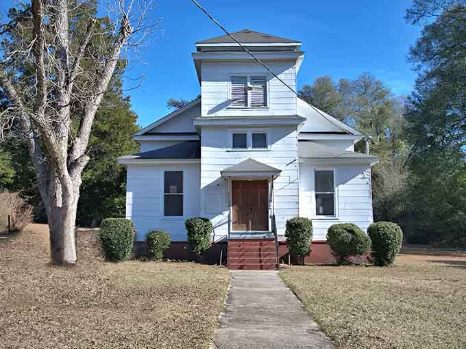This stately home's symmetrical charm proves that affordable living doesn't mean sacrificing architectural grace and dignity.