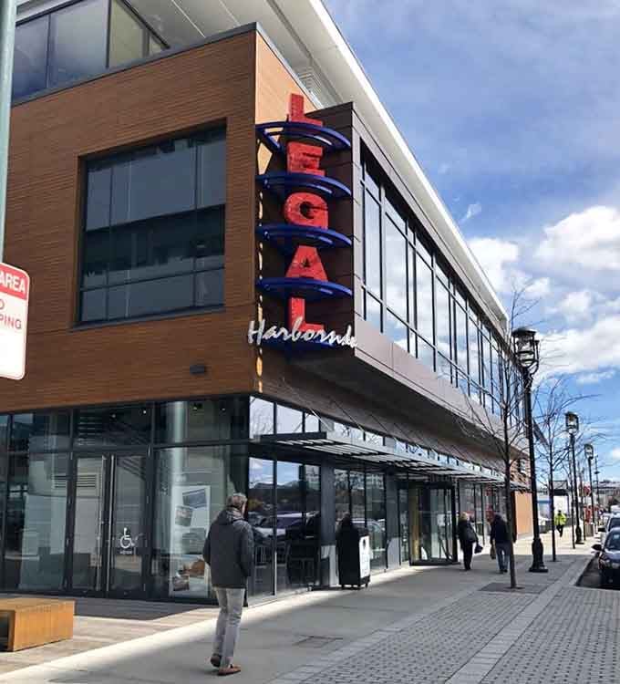 The retro neon sign towers above this harborside location, promising classic New England seafood done right every single time.