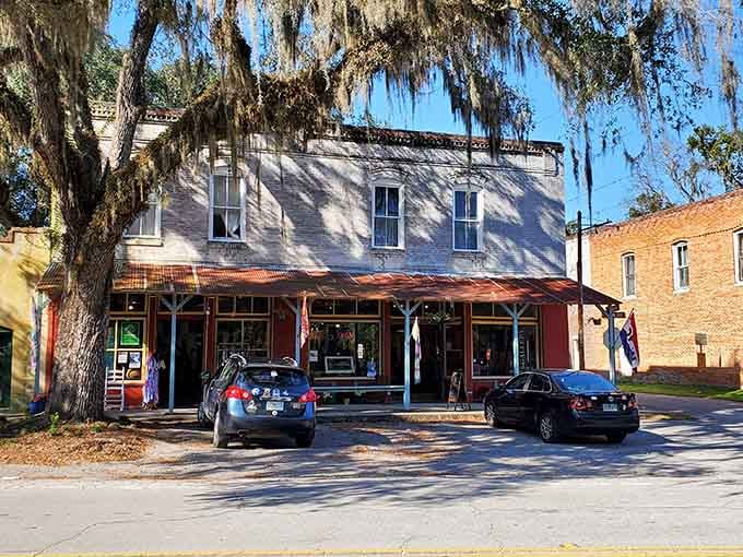 Spanish moss creates a natural canopy over this historic building, shading generations of community memories.