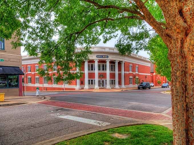 Stately columns frame the entrance like a grand welcome, giving the building an inviting sense of pride and presence.