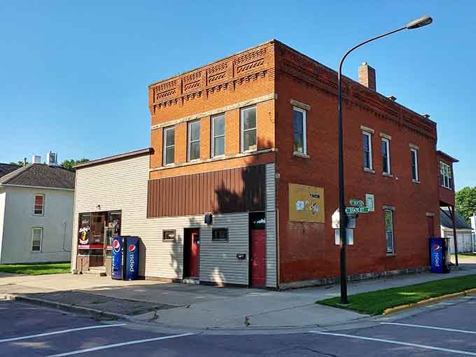 Brick buildings with decorative cornices stand shoulder-to-shoulder like old friends sharing secrets across the generations.