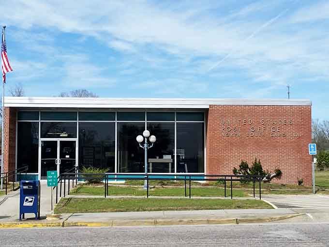 Clean lines and glass windows mark this postal hub where neighbors exchange greetings and mail daily.