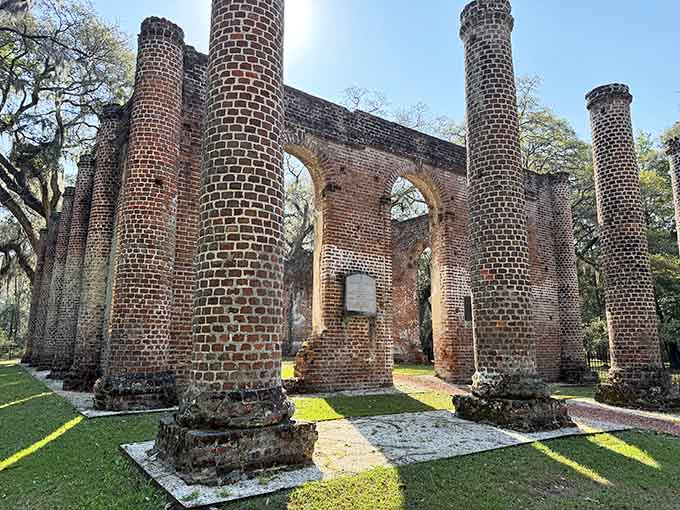 Brick columns reach skyward from these historic ruins, their empty windows now framing clouds instead of stained glass.