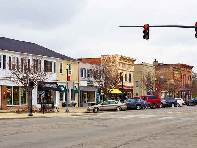 Charming storefronts create a downtown streetscape where window shopping actually means looking in windows, not scrolling through your phone mindlessly.