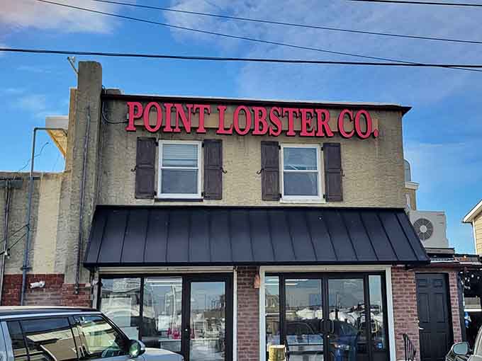 Bold lettering against weathered brick signals serious lobster business happening inside this no-nonsense Point Pleasant Beach favorite spot.