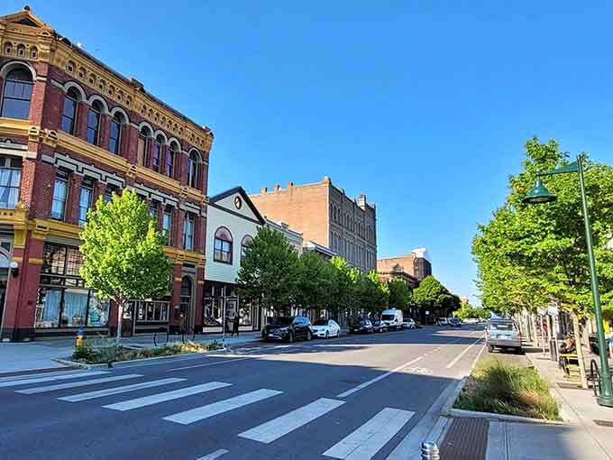 Brick buildings march up the slope in this college town where students and locals share sidewalks that connect campus to community.