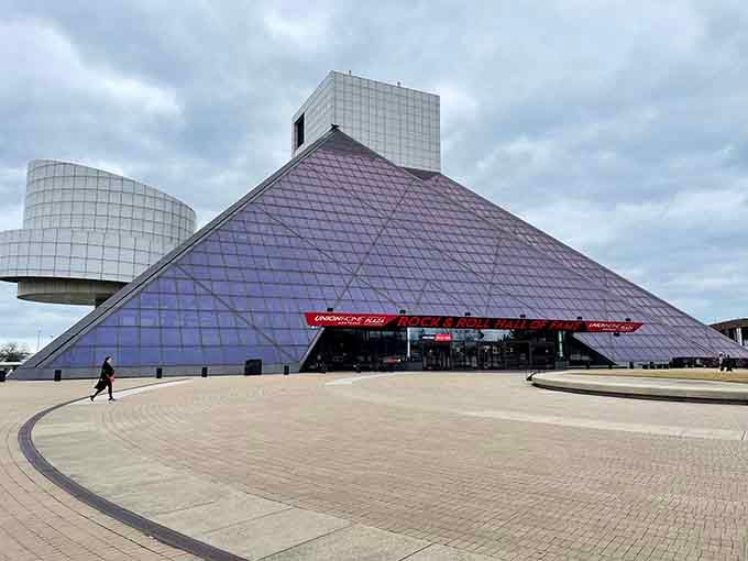 The Rock Hall's iconic pyramid rises against Lake Erie like a monument to every guitar solo ever played.