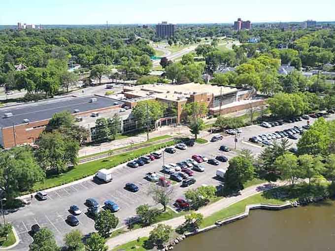 Green spaces meet urban waterways in this bird's-eye view of affordable living where nature and convenience share the same address.