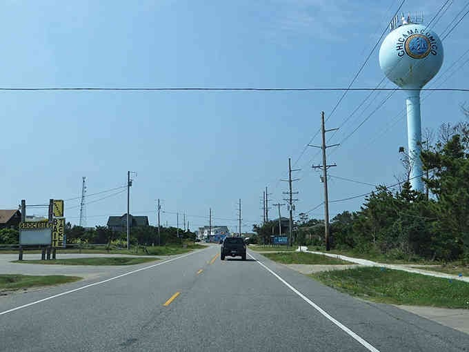 That water tower stands like a friendly sentinel welcoming travelers to slow down and stay awhile, friend.