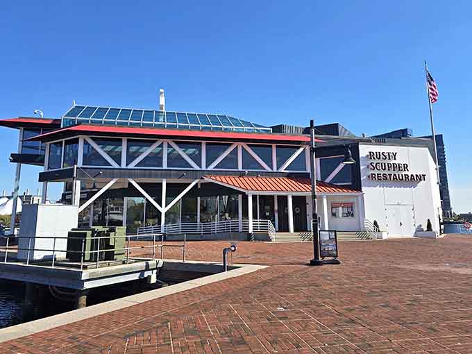 The brick walkway leads straight to seafood paradise, where that distinctive orange awning has welcomed hungry diners for decades.