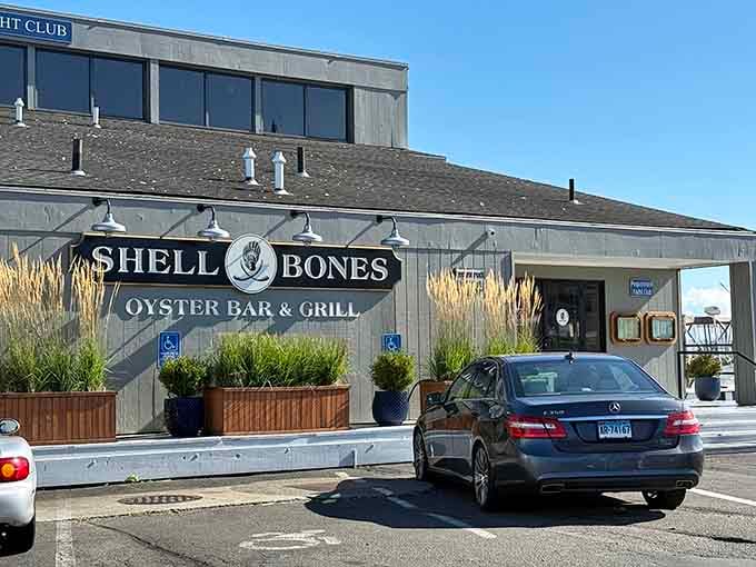 Modern industrial style meets waterfront dining where those planters add just enough green to soften the sleek design.