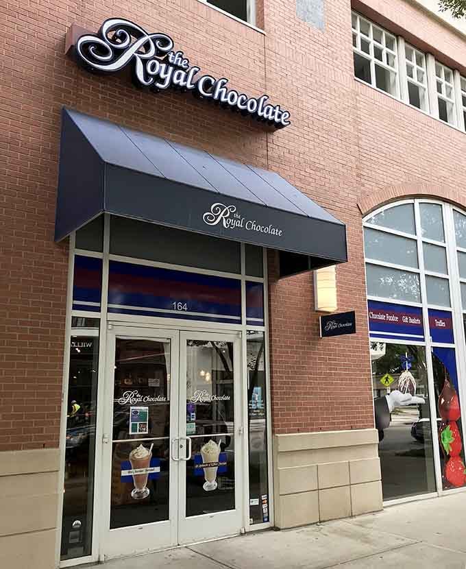 Elegant script lettering on brick announces chocolate royalty resides here – and they're ready to serve you.