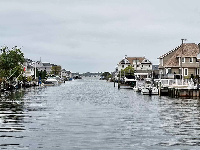 Waterfront homes line the canal where boats bob gently, creating that coveted backyard-to-water lifestyle many dream about.