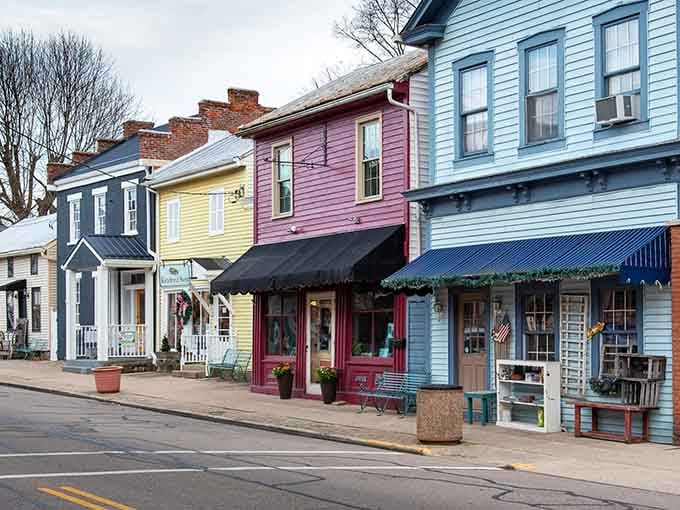 Rainbow-colored buildings create a cheerful streetscape that looks like someone spilled a paint box in the best way.