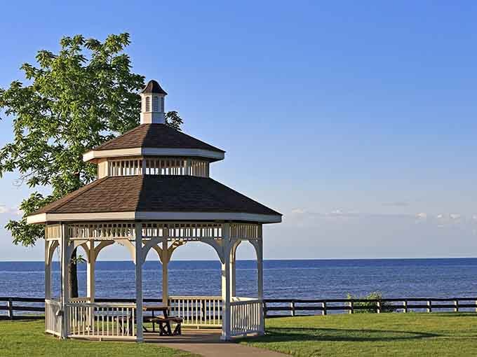 That lakefront gazebo frames Lake Erie's endless blue horizon like a postcard you'd send to make friends jealous.