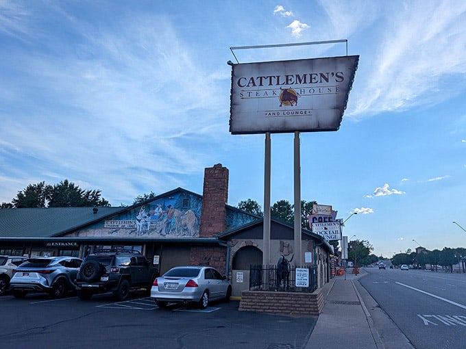 That tall roadside sign guides hungry travelers to mountain-town steaks worth writing home about.