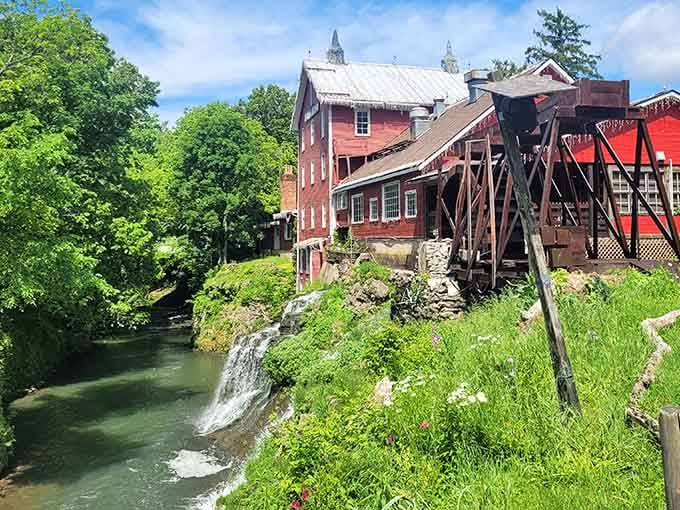 Summer greenery surrounds this working mill where water power and natural beauty have partnered for generations.