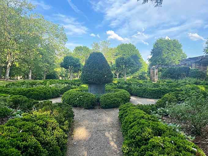 Manicured hedges create living labyrinths of green, inviting you to wander paths where every turn reveals another carefully crafted view.