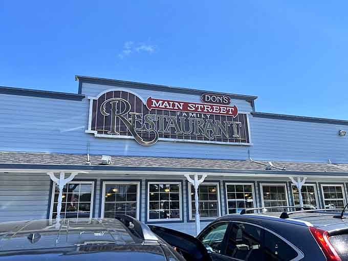 The blue and white color scheme and long row of windows give this family restaurant a clean, welcoming Main Street appeal.