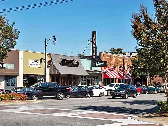 Vintage storefronts and classic theater marquees create an authentic Main Street that modern developers try desperately to replicate.