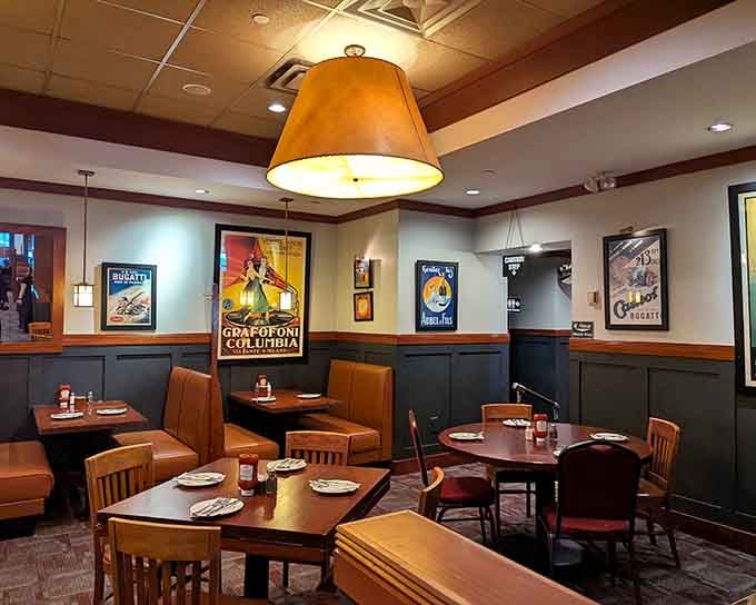 Vintage ski posters adorning the walls add nostalgic charm to this comfortable dining room where classic American steakhouse traditions thrive beautifully.