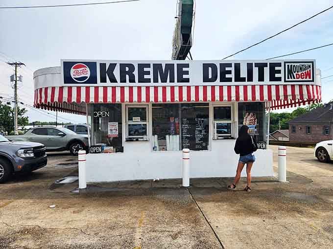 The circular drive-in design with its bold stripes looks like it rolled straight out of Happy Days reruns.