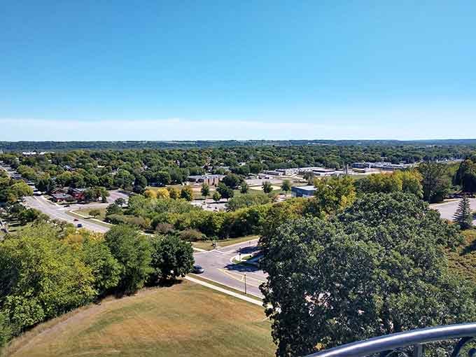 Tree canopy stretches endlessly beyond downtown, showing how these towns blend seamlessly into Minnesota's natural landscape.