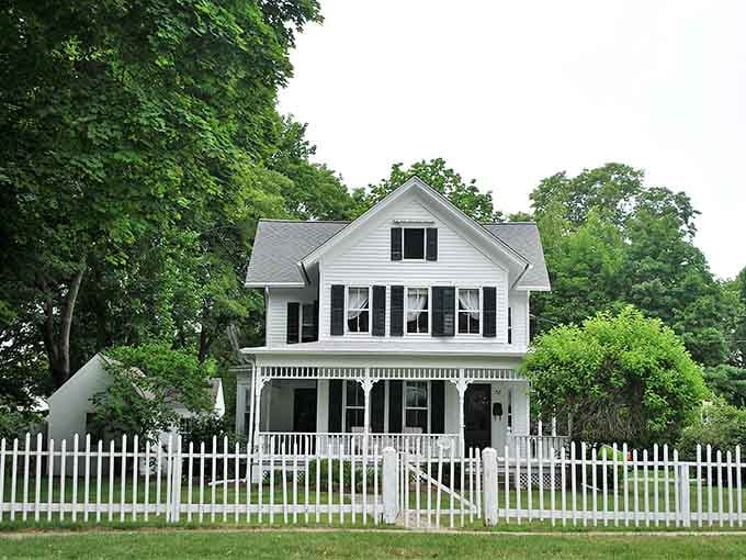White picket fence and wraparound porch deliver that American dream aesthetic your grandparents talked about at every family gathering.