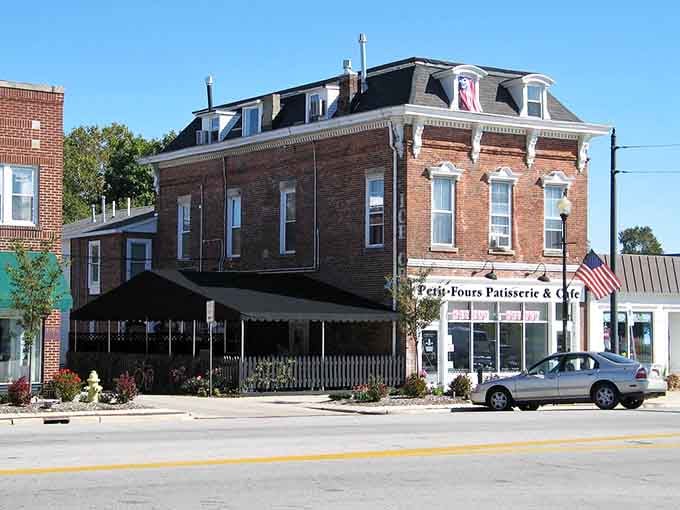 The elegant mansard roof and ornate details of this corner building showcase craftsmanship from an era when builders took serious pride in their work.