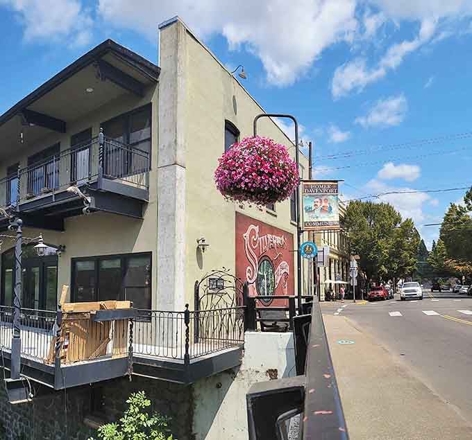 Hanging flower baskets add cheerful pops of pink to buildings where small-town charm never goes out of style.