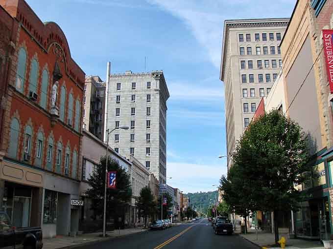 Tree-lined streets frame the view down this main drag where the pace slows and neighbors still wave.