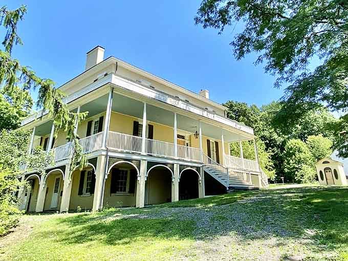 Graceful arches support the sunny porch where Thomas Cole once contemplated the very landscapes he transformed into iconic American masterpieces.