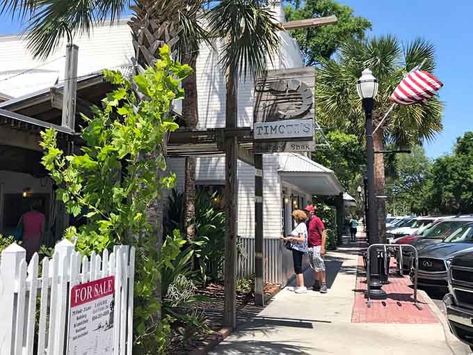Lush greenery frames the entrance like nature's way of saying you've found something genuinely special here.