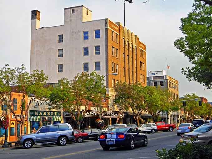 Golden light bathes vintage buildings in warm tones, making ordinary Tuesday afternoons feel special and worth savoring completely.