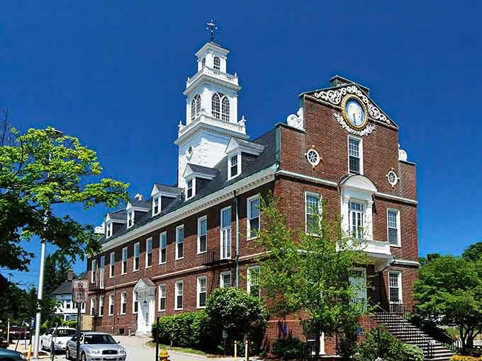 Classic New England architecture basks in blue skies, looking exactly like the town hall from every feel-good movie.