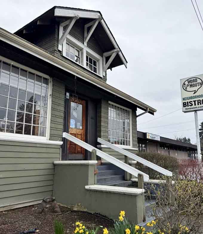 Fresh spring daffodils bloom beside the craftsman-style entrance where neighborhood breakfast dreams come deliciously true.