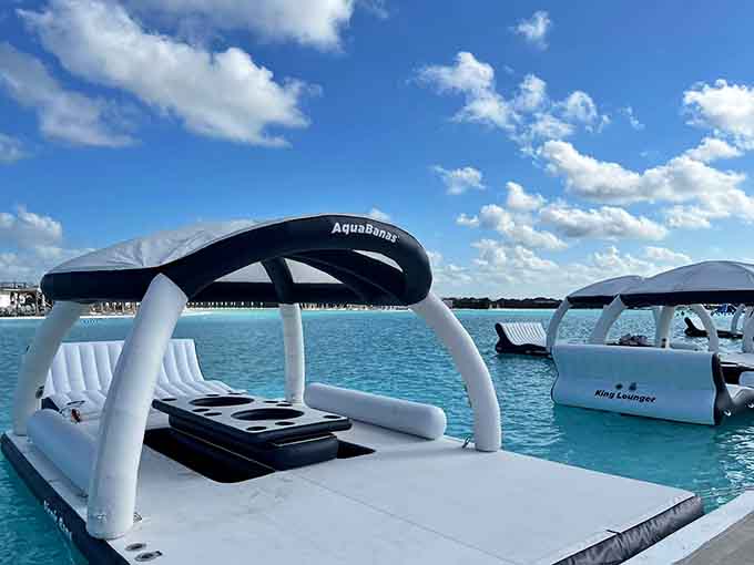 Your personal floating oasis comes complete with shade, cup holders, and the kind of turquoise water that makes you question reality.