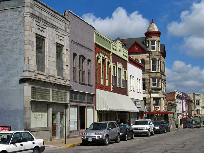Colorful historic buildings line Sedalia&rsquo;s street, blending classic architecture and small town charm, inviting visitors to explore shops and enjoy local culture.