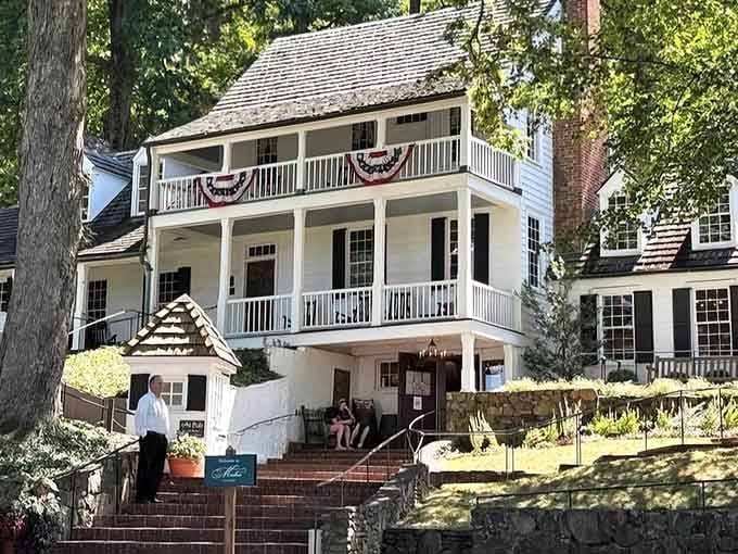 Patriotic bunting decorates the balconies like it's perpetually the Fourth of July, which feels appropriate for 1784.