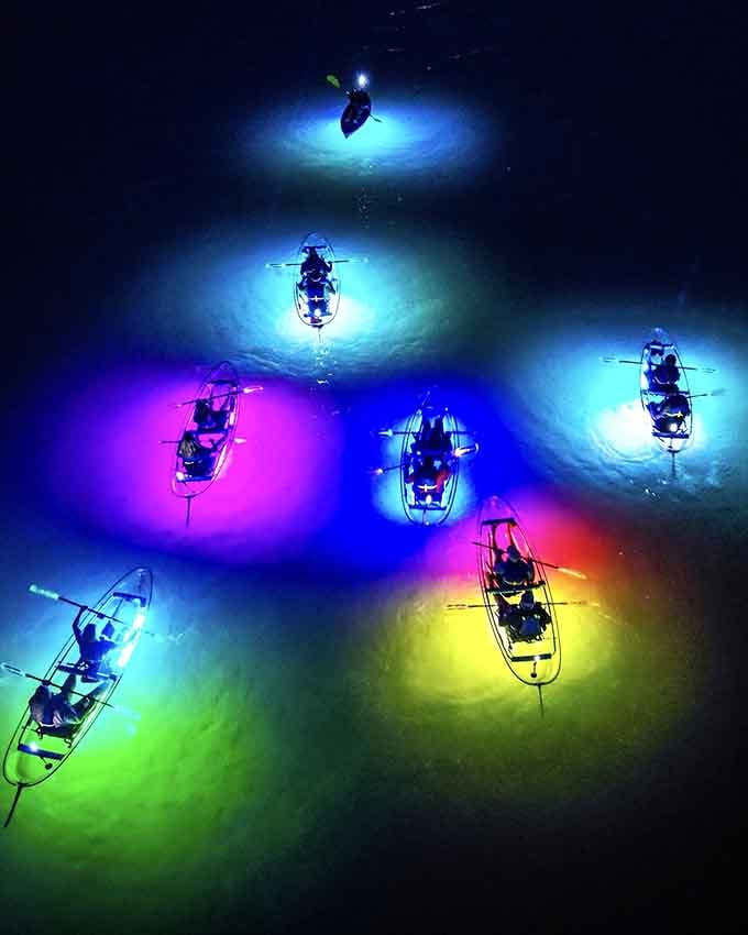 Floating in technicolor pools of purple and yellow light, this North Padre night paddle beats watching TV at home.