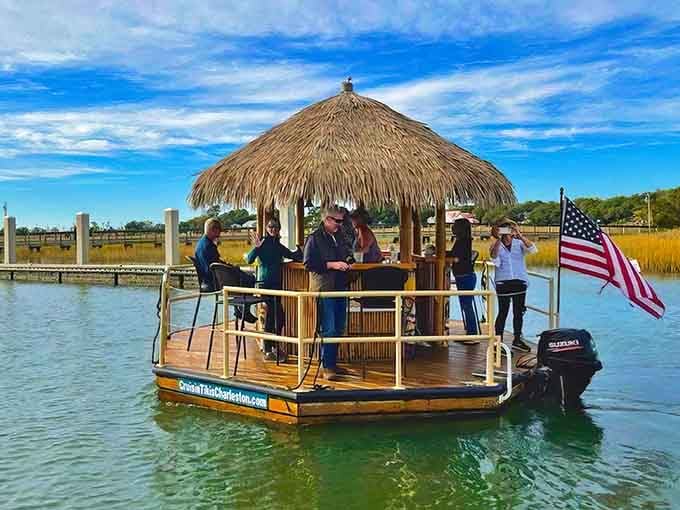 That thatched roof and American flag combo proves patriotism pairs perfectly with tropical vibes on Charleston's shimmering waters.