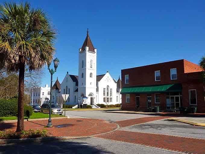 A white steeple church anchors the town square, proving some things are too beautiful to ever go out of style.