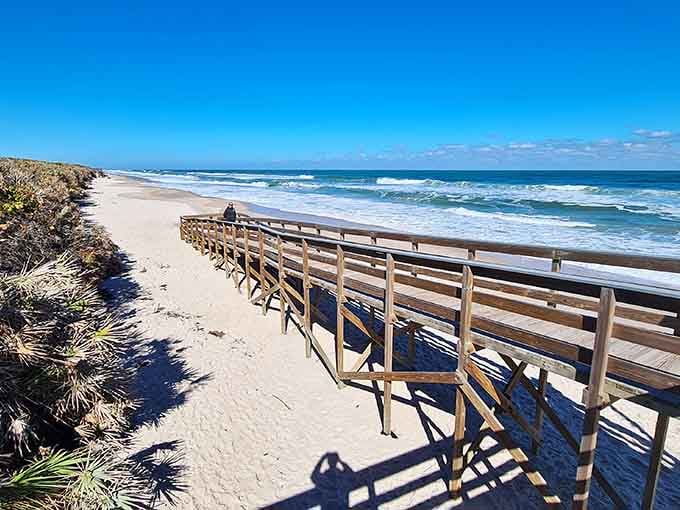 The wooden boardwalk at Playalinda Beach leads you through protected dunes straight to miles of pristine, uncrowded Atlantic coastline ahead.