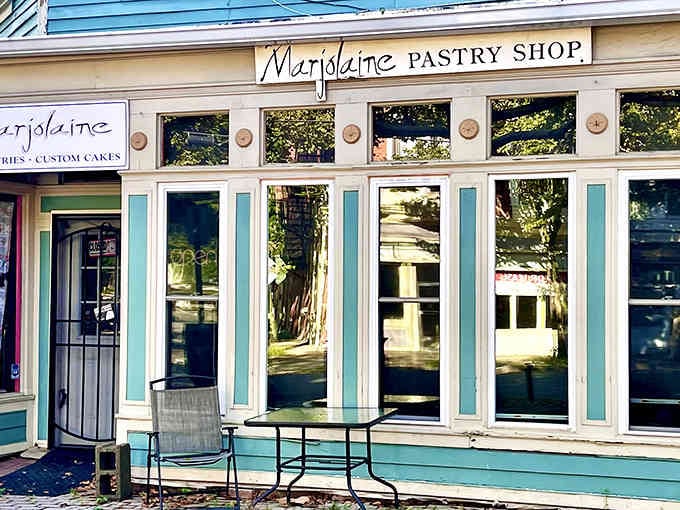 The inviting facade practically whispers, "Come inside, we have croissants," and honestly, who could possibly resist that kind of temptation?