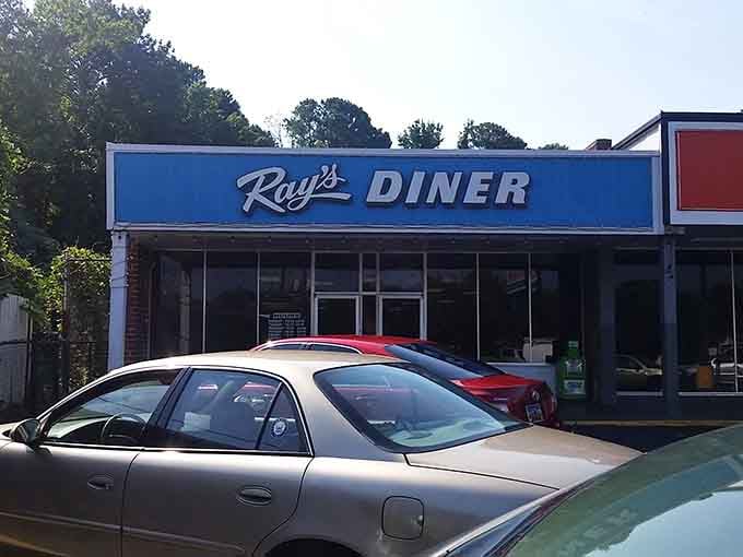 That bright blue sign isn't just directing you to breakfast, it's pointing toward pure morning happiness.