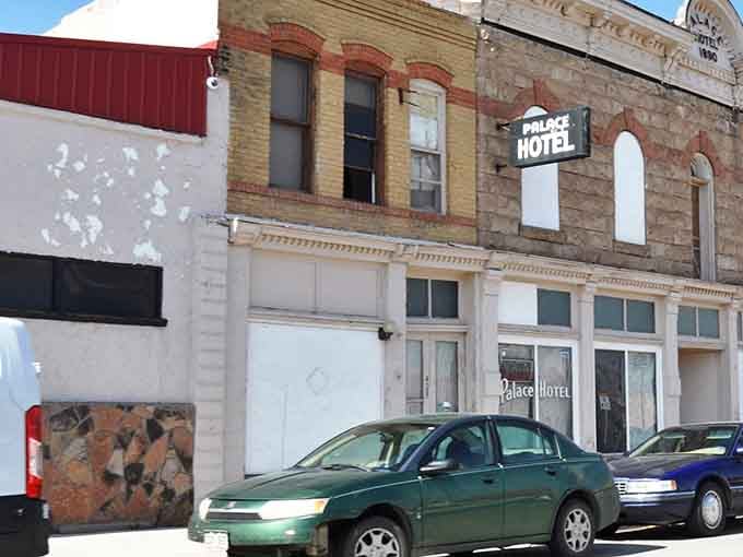 The Palace Hotel stands proud on Main Street, its vintage facade whispering stories from Colorado's railroad heyday.