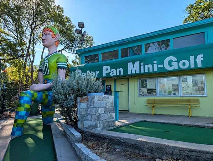 That giant Peter Pan isn't just waving hello, he's basically daring you to stay serious about adulting today.