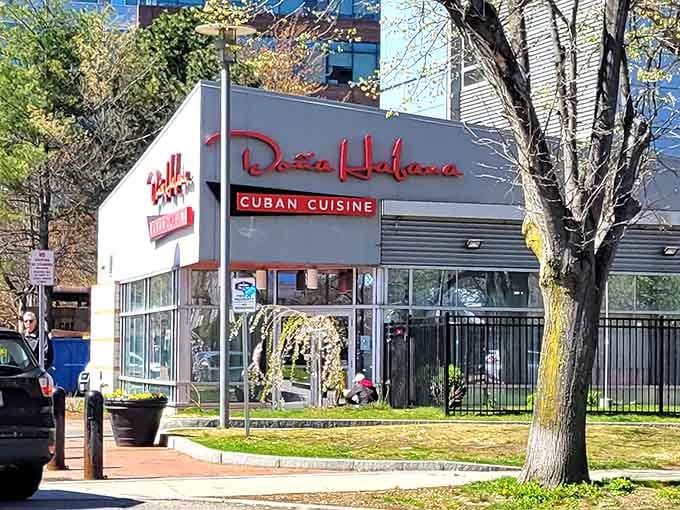 That bold red signage practically glows with Caribbean warmth, beckoning you to trade Boston's chill for Havana's heat.