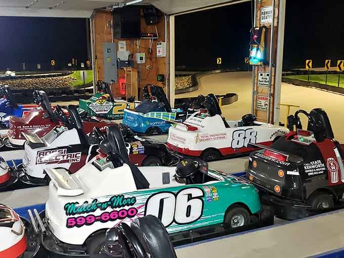 These sleek racing machines await their drivers like thoroughbreds at the starting gate, ready for speed.