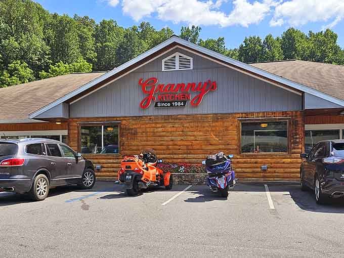 That red script sign against wood paneling isn't just decoration&mdash;it's a beacon calling hungry travelers home.